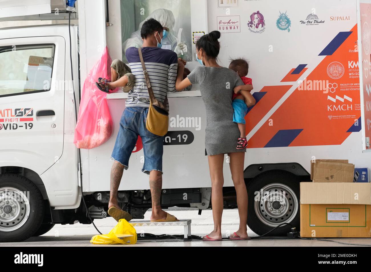 Health workers collect nasal swabs from locals for coronavirus testing ...