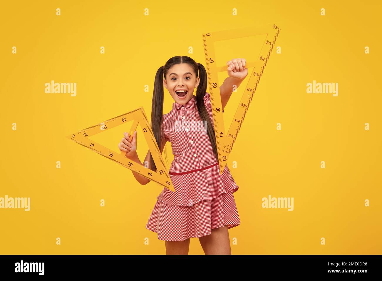 Teenager child school girl holding measure for geometry lesson ...