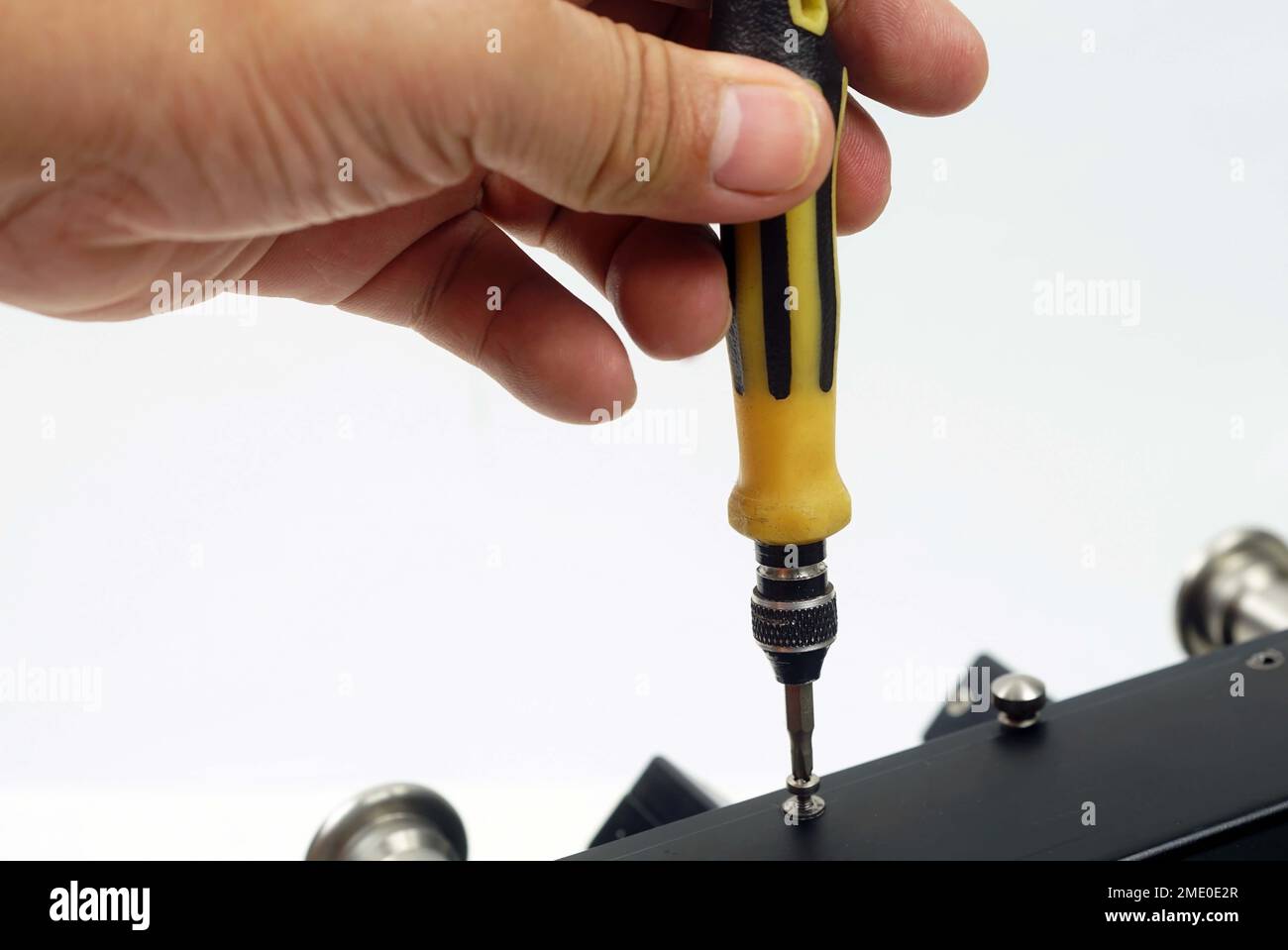 A hand was turning the screw driver to installing Stock Photo - Alamy