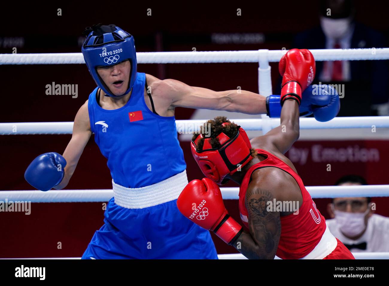Oshae Jones, of the United States, in red, and Hong Gu, of China, trade ...