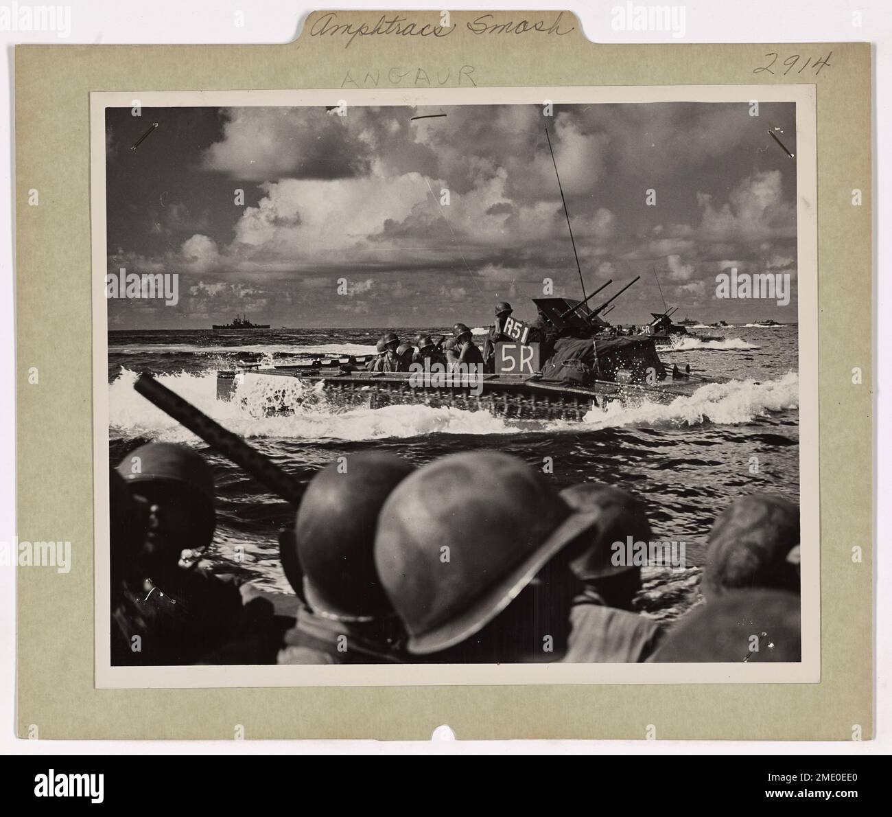 Amphtracs Smash Against the Beach of Angaur. Guns readied, grim-faced ...