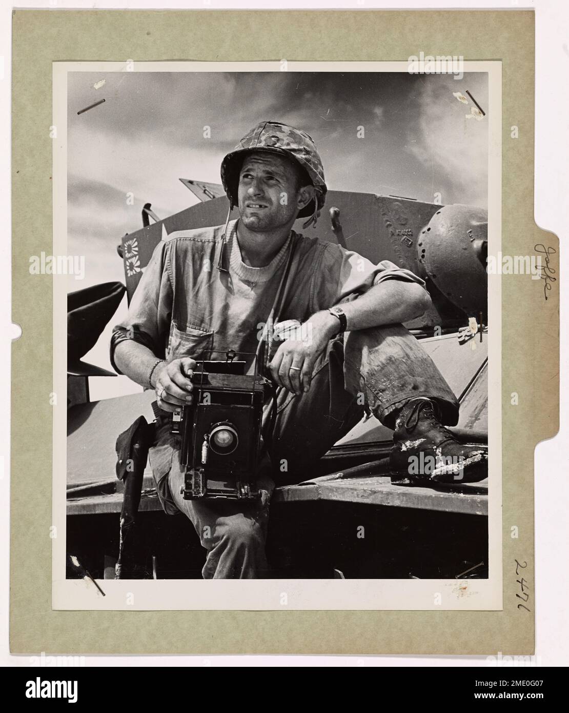 Coast Guard Combat Photographer Edgar K. Jaffe, armed with a gun and ...
