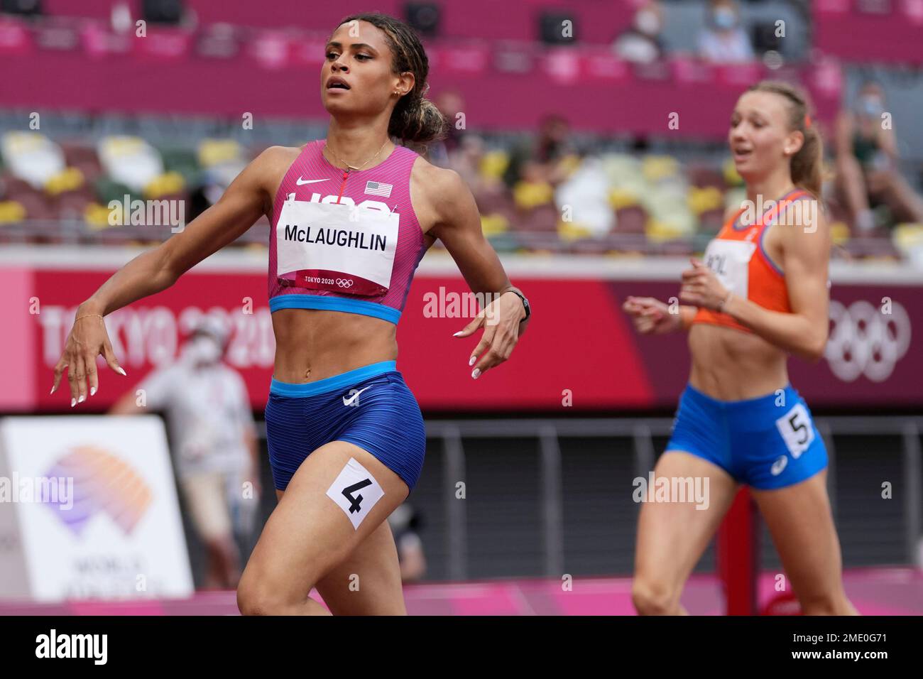 Sydney McLaughlin, of the United States, crosses the finish line to win ...
