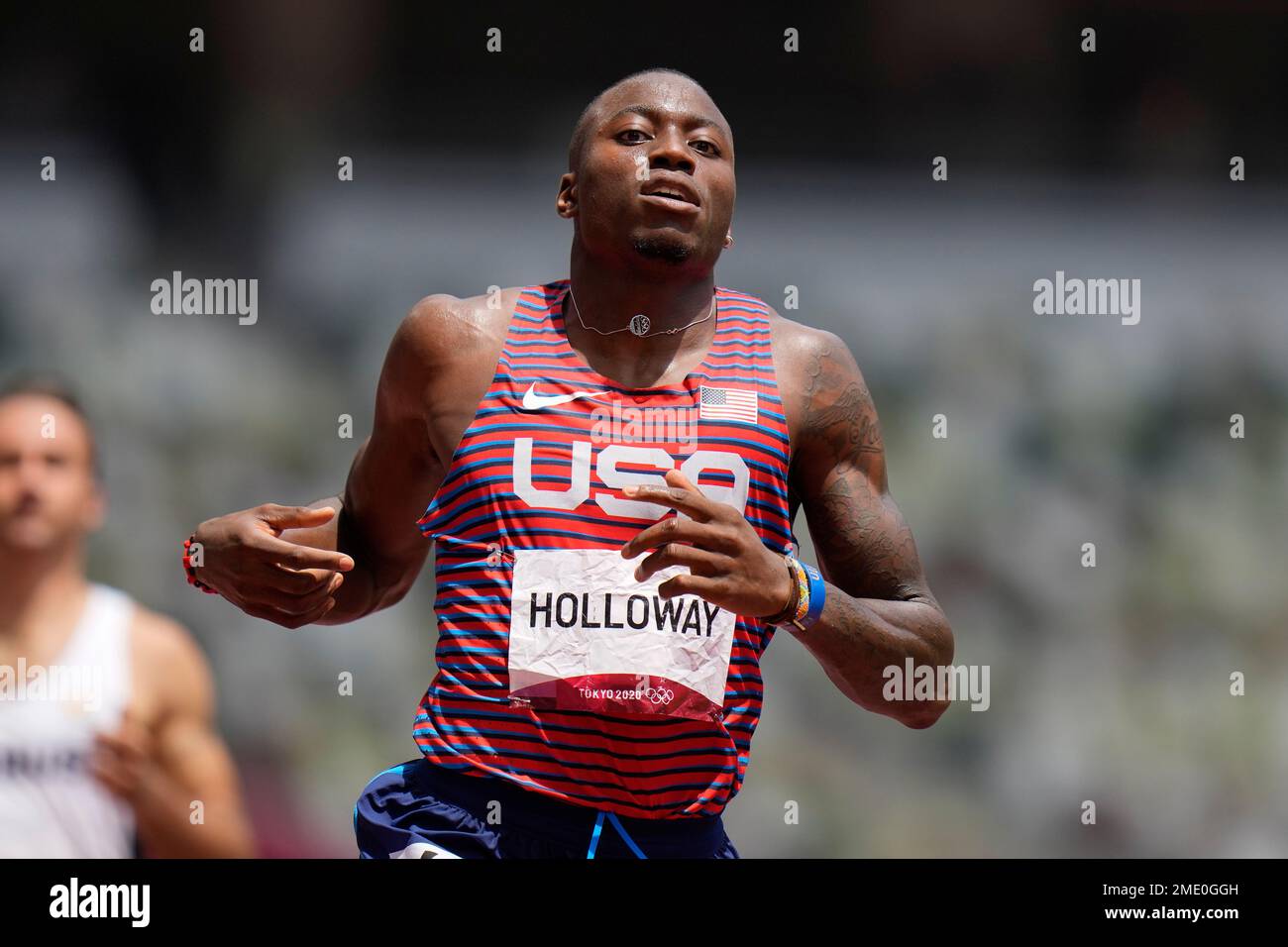 Grant Holloway, of the United States, wins a semifinal in the men's 110 ...
