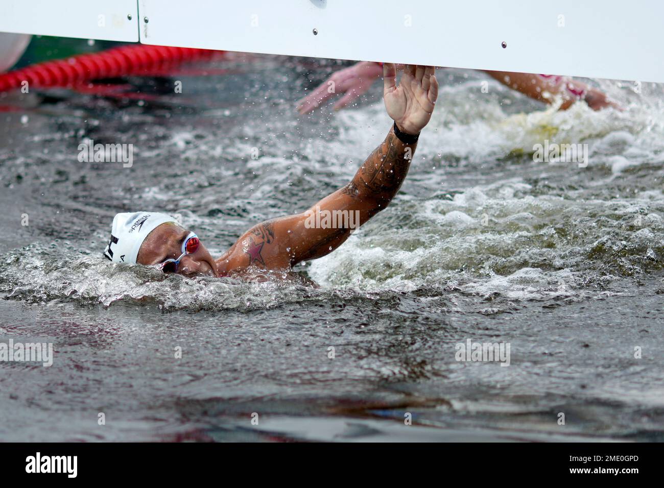 Ana Marcela Cunha, of Brazil, tags the timing board to win the women's ...