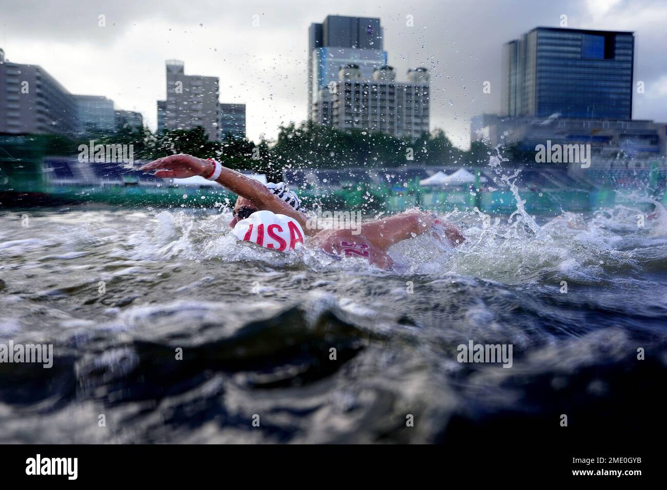 Haley Anderson, of the United States, front, swims next to Anna Olasz ...