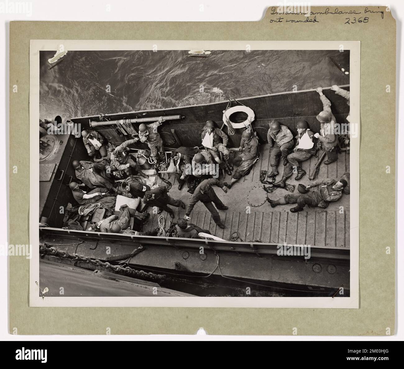 Invasion "Ambulances" Bring Out the Wounded. Tying up alongside a Coast ...