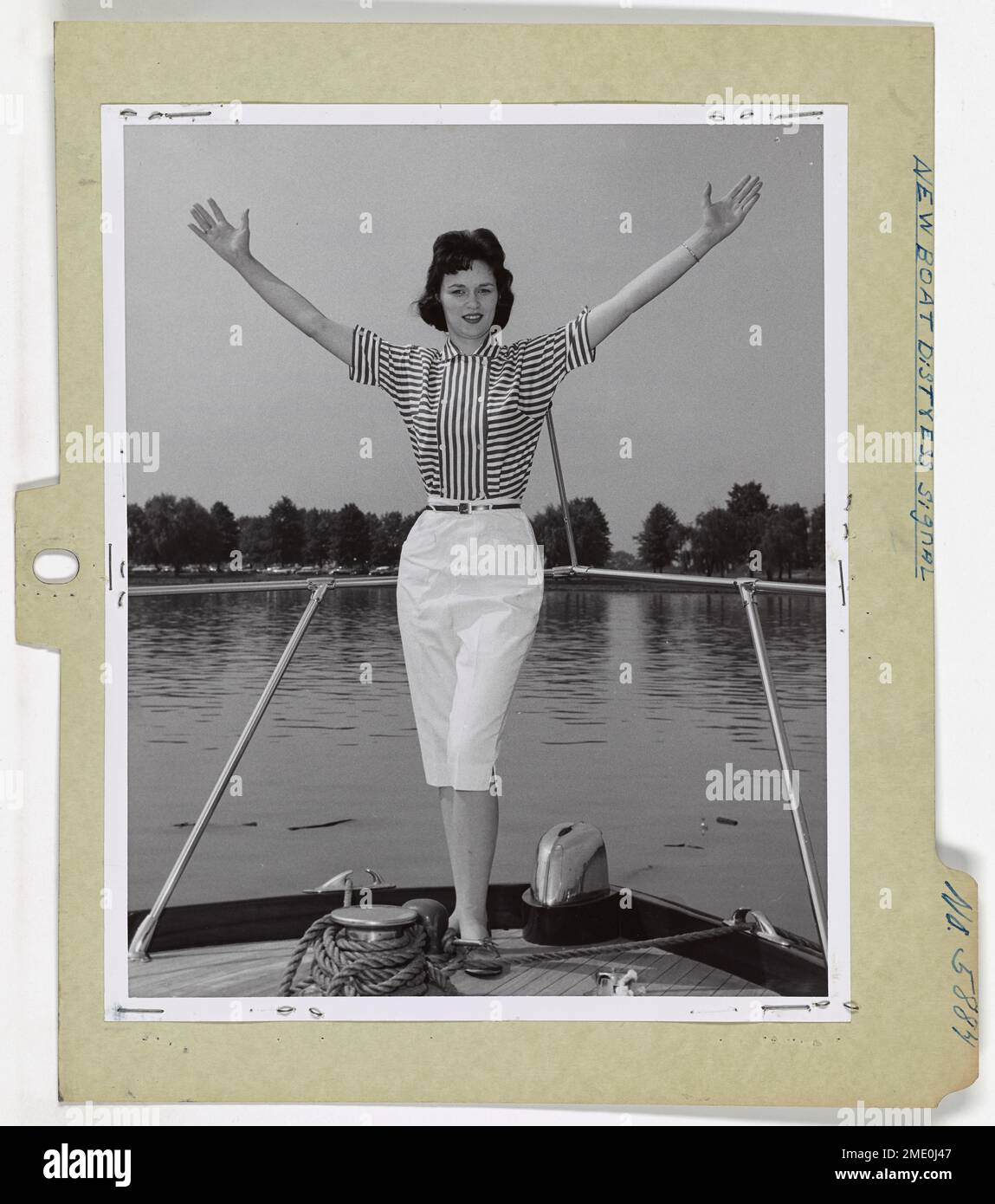 Miss Lillian Hatcher demonstrates a new daytime distress signal for ...