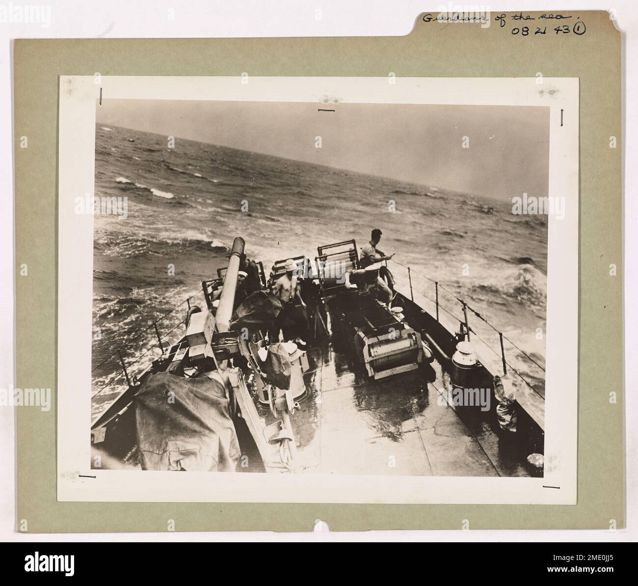 This photograph shows a Coast Guard cutter navigating through rough ...
