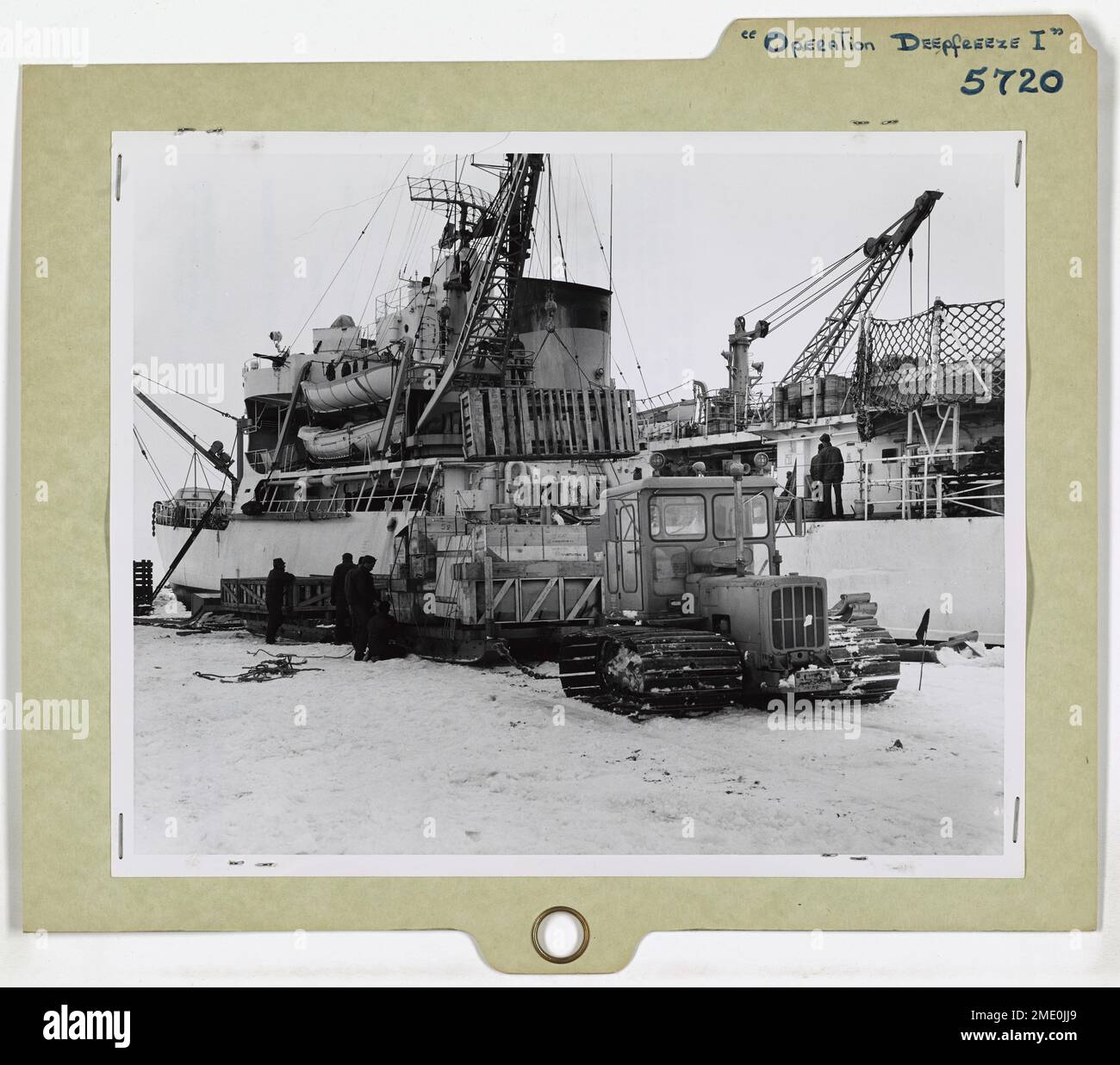During Operation Deep Freeze I, Coast Guardsmen load cargo from the ...
