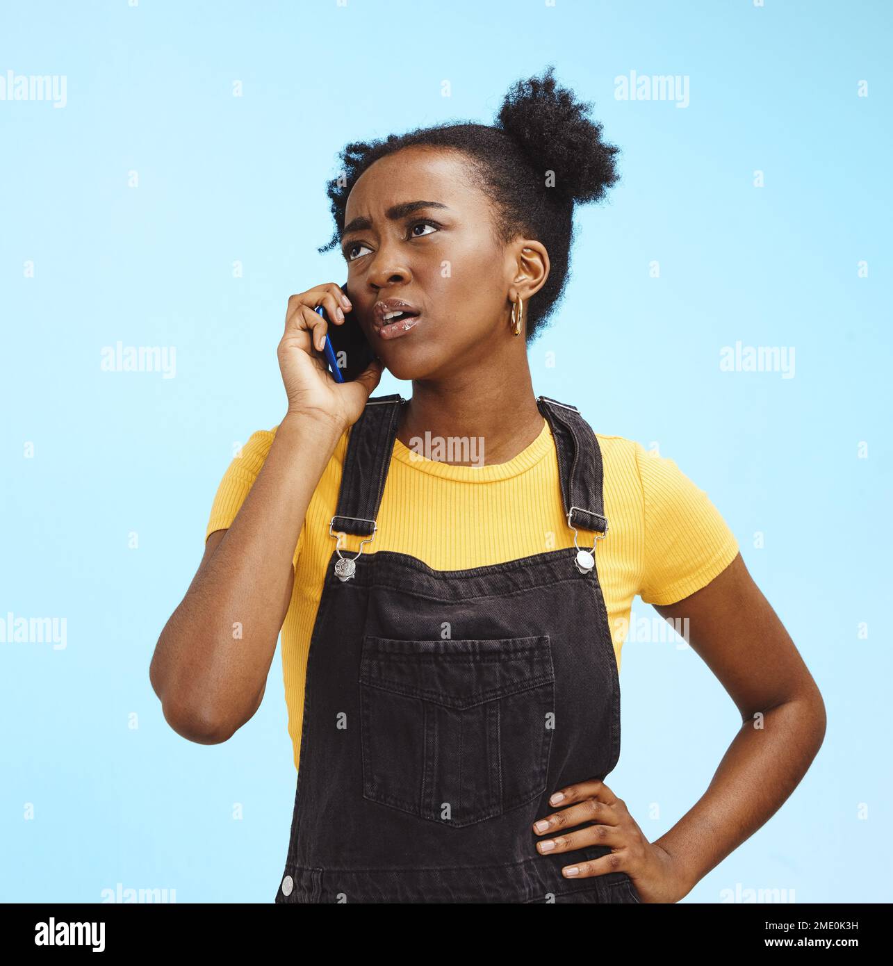Phone call, confused and black woman on blue background with spam ...