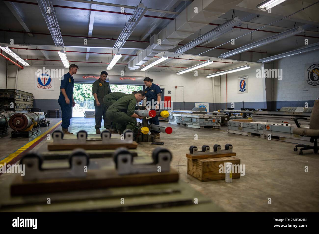 Aviation Ordnance Systems Technicians pickup an Air Intercept Missile ...