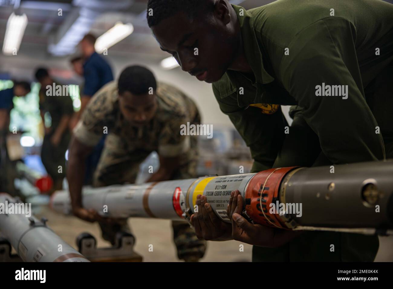 Aviation Ordnance Systems Technicians pickup an Air Intercept Missile ...