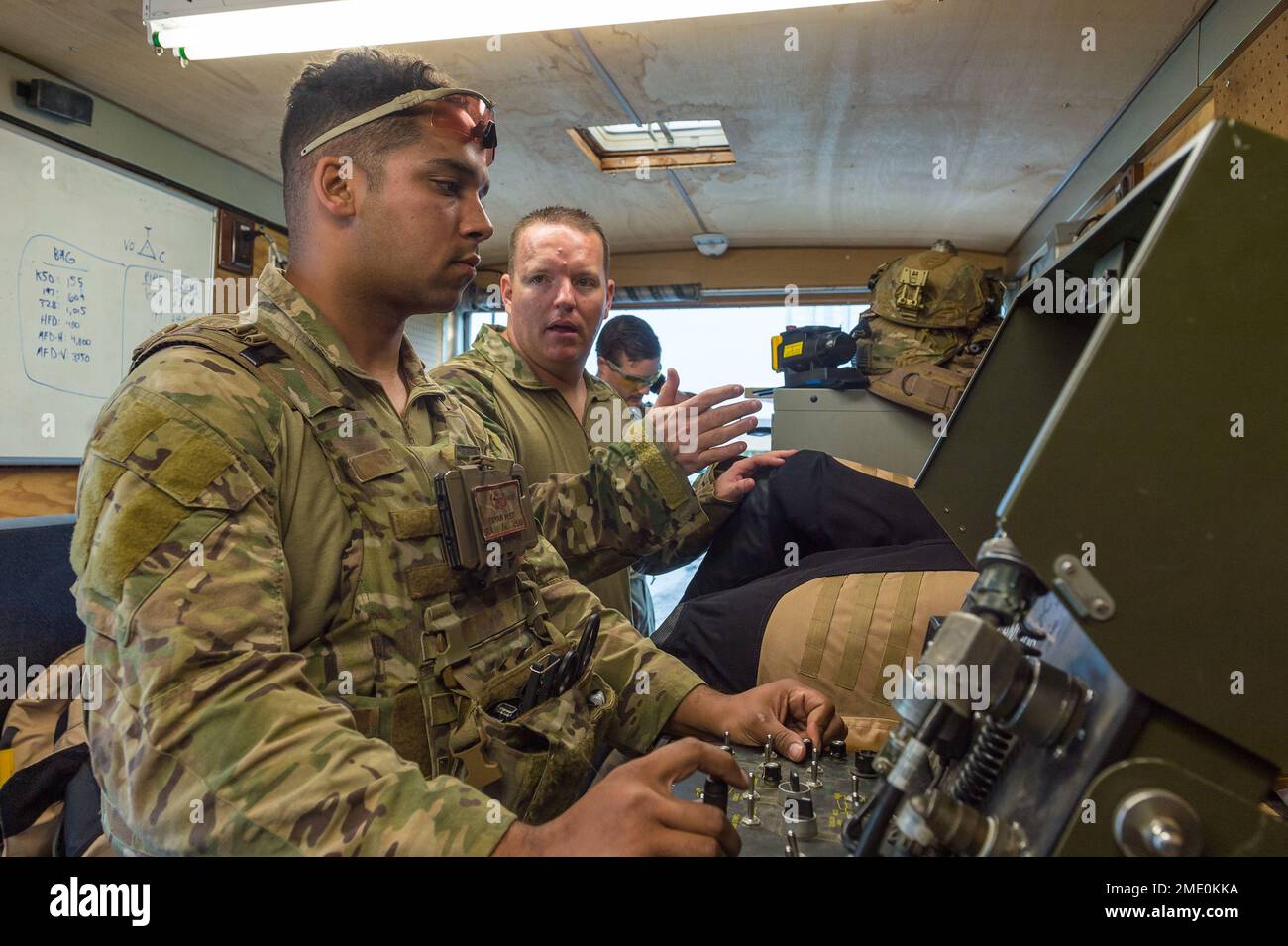 Senior Airman Bryan Post, left, an explosive ordnance disposal ...