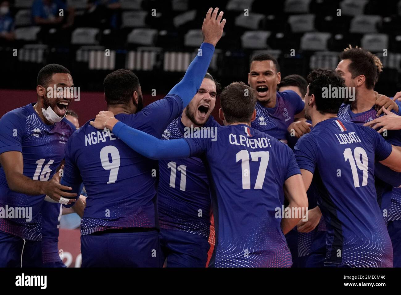 Team France celebrate their 3-2 victory over Poland at the end of a men ...