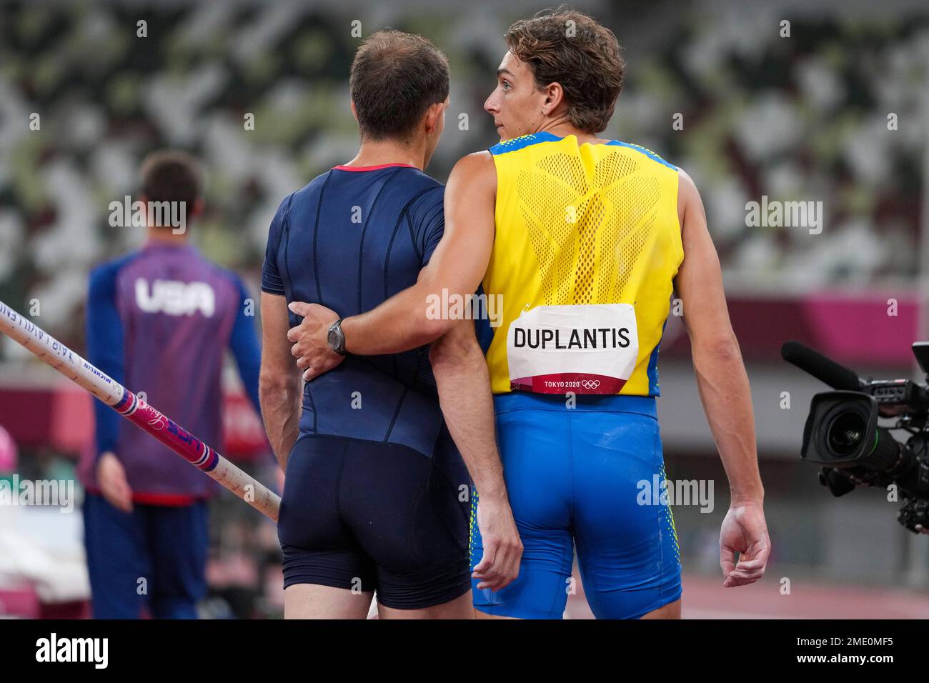 Armand Duplantis, right, of Sweden, walks off with Renaud Lavillenie ...