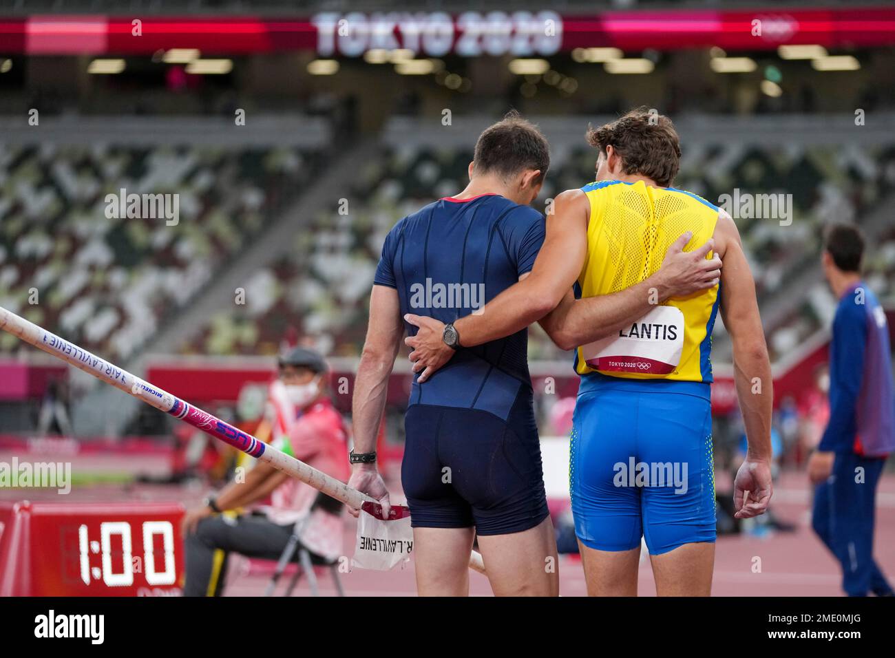 Armand Duplantis, right, of Sweden, walks off with Renaud Lavillenie ...