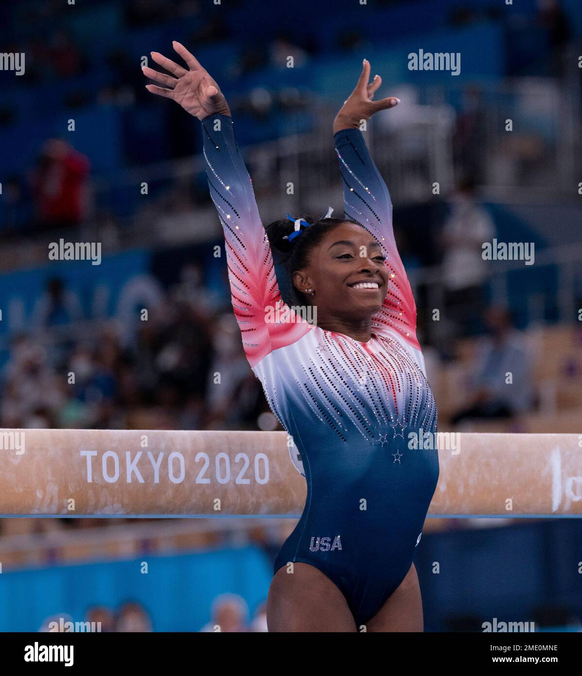 Simone Biles, from the United States, competes in the balance beam ...