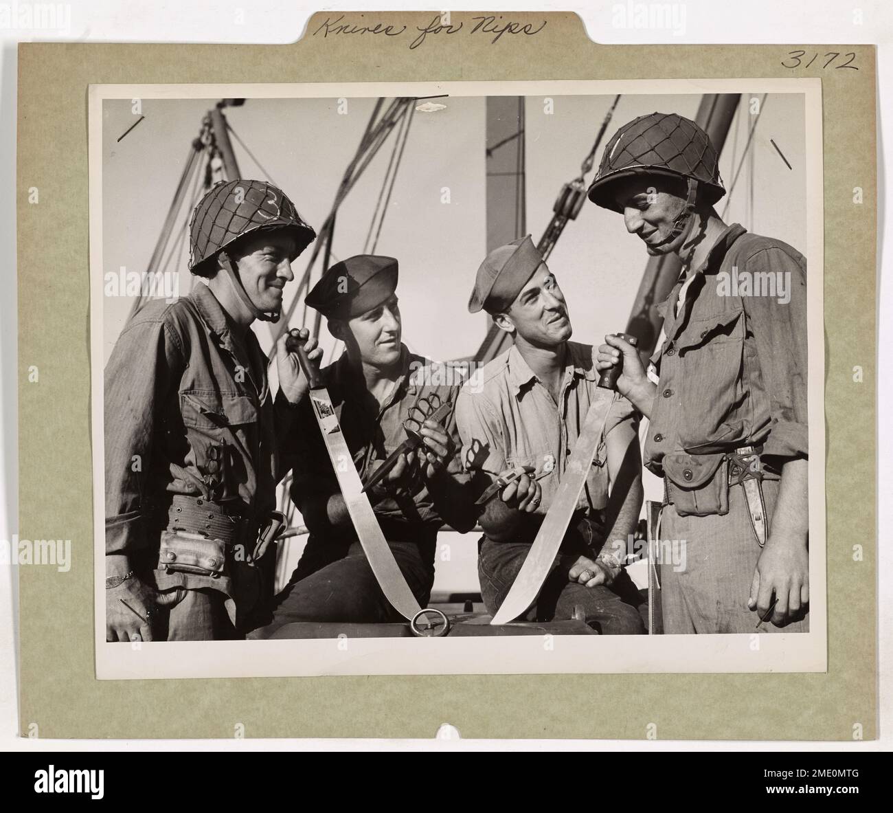 This image depicts U.S. Coast Guardsmen and soldiers comparing various ...