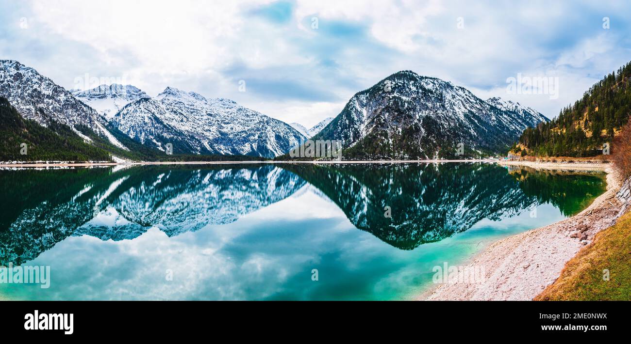 The beautiful landscape of Plansee lake in Austria with snowy mountains ...