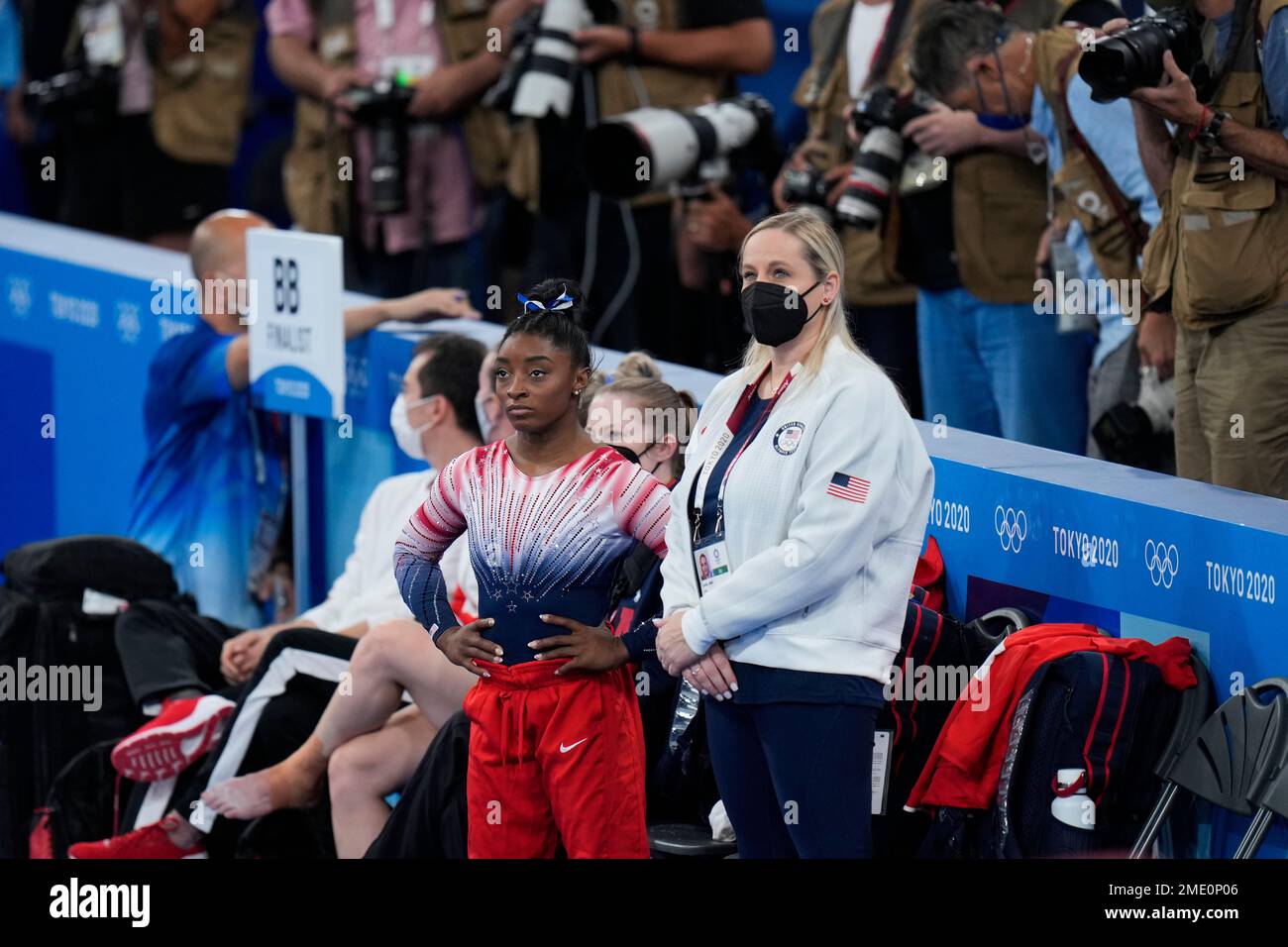 Simone Biles, of the United States, stands next to her coach Cecile ...