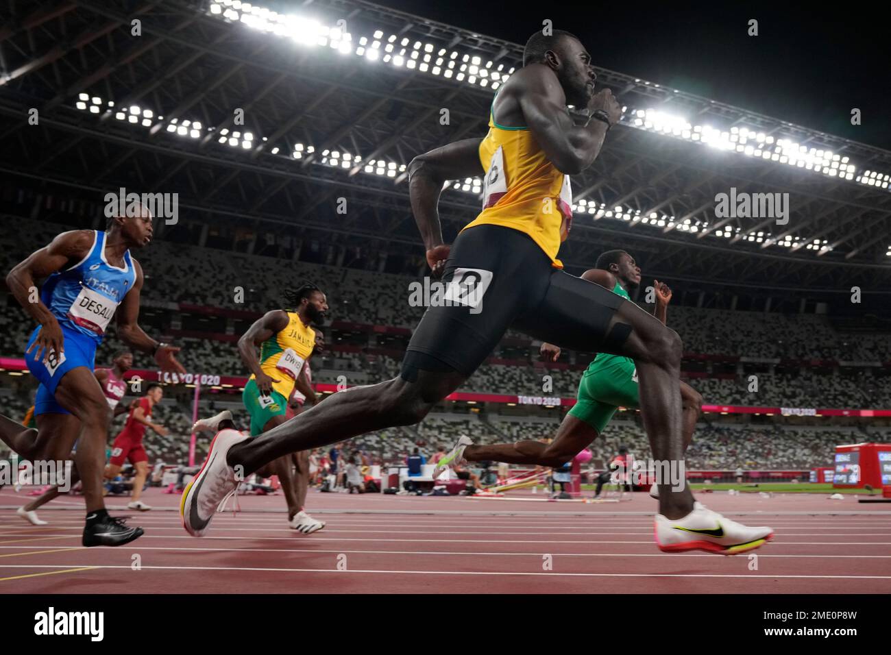 Joseph Amoah, of Ghana, competes in a semifinal of the men's 200-meters ...