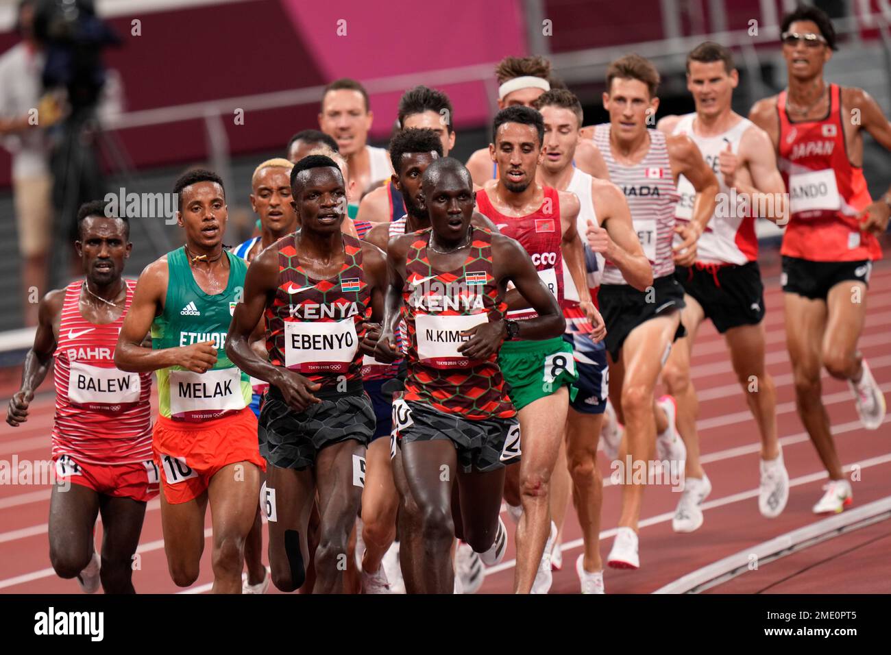 Runners compete in a heat of the men's 5,000-meters at the 2020 Summer ...