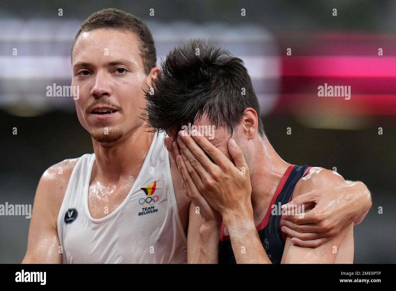 Robin Hendrix, of Belgium, left, embraces Hugo Hay, of France, after ...
