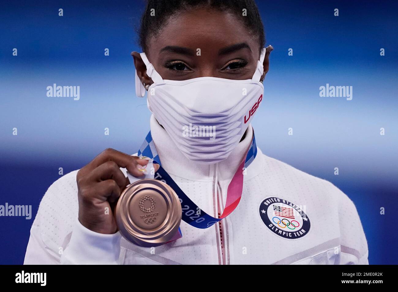 Simone Biles, of the United States, poses with her bronze medal after ...