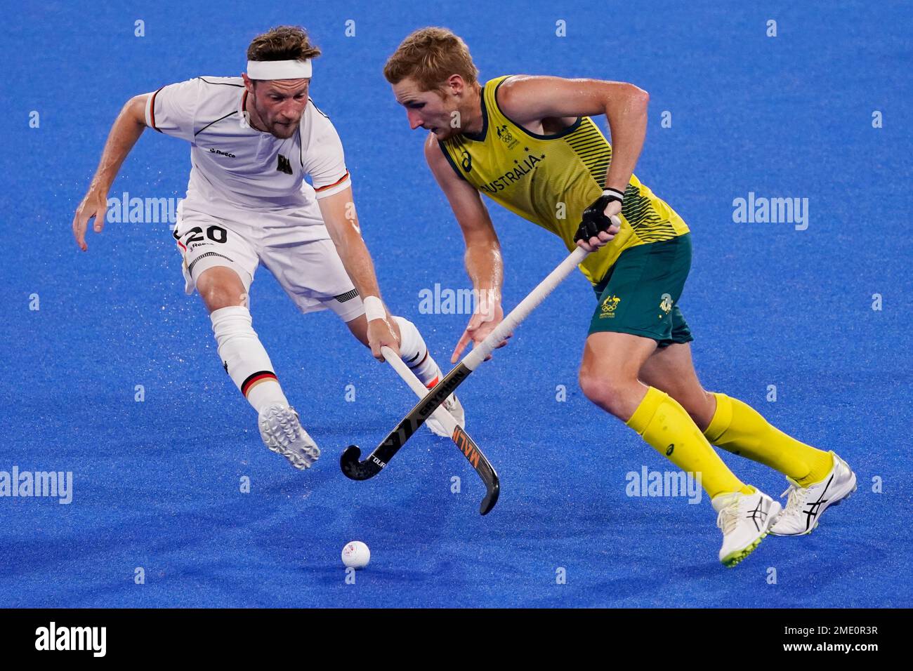 Australia's Daniel James Beale (23) drives against Germany's Martin ...