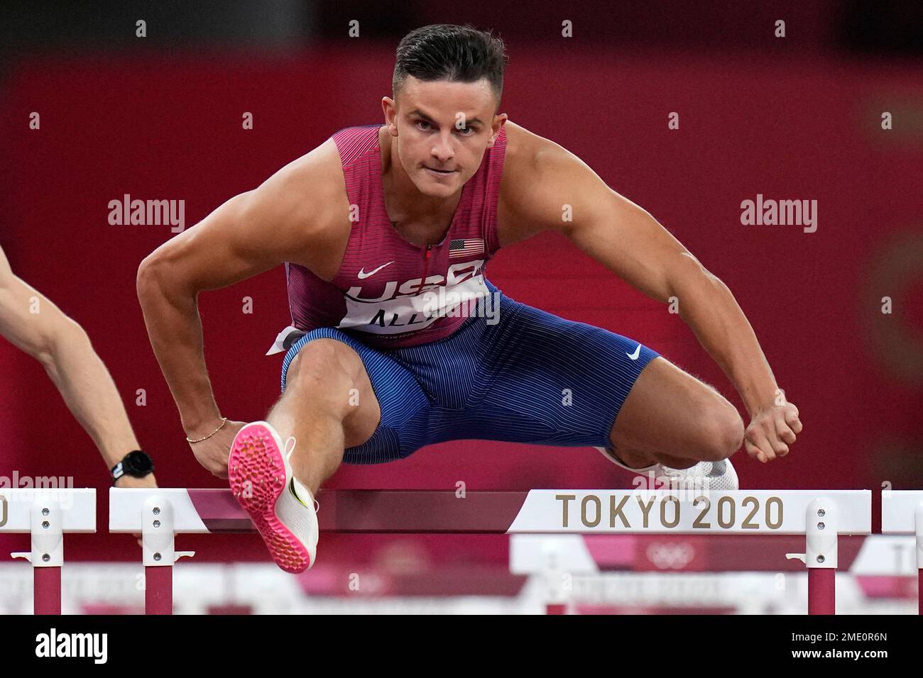 Devon Allen, of the United States, competes in a heat of the men's 110 ...