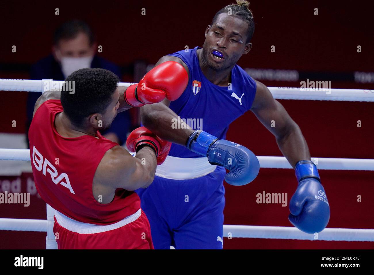 Brazil's Abner Teixeira, left, exchanges punches with Cuba's Julio la ...