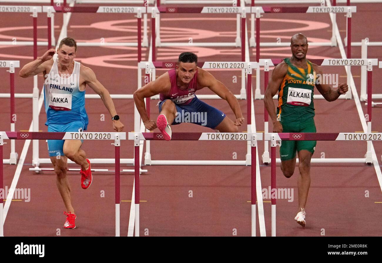 Devon Allen, of United States, center, competes alongside Elmo Lakka ...