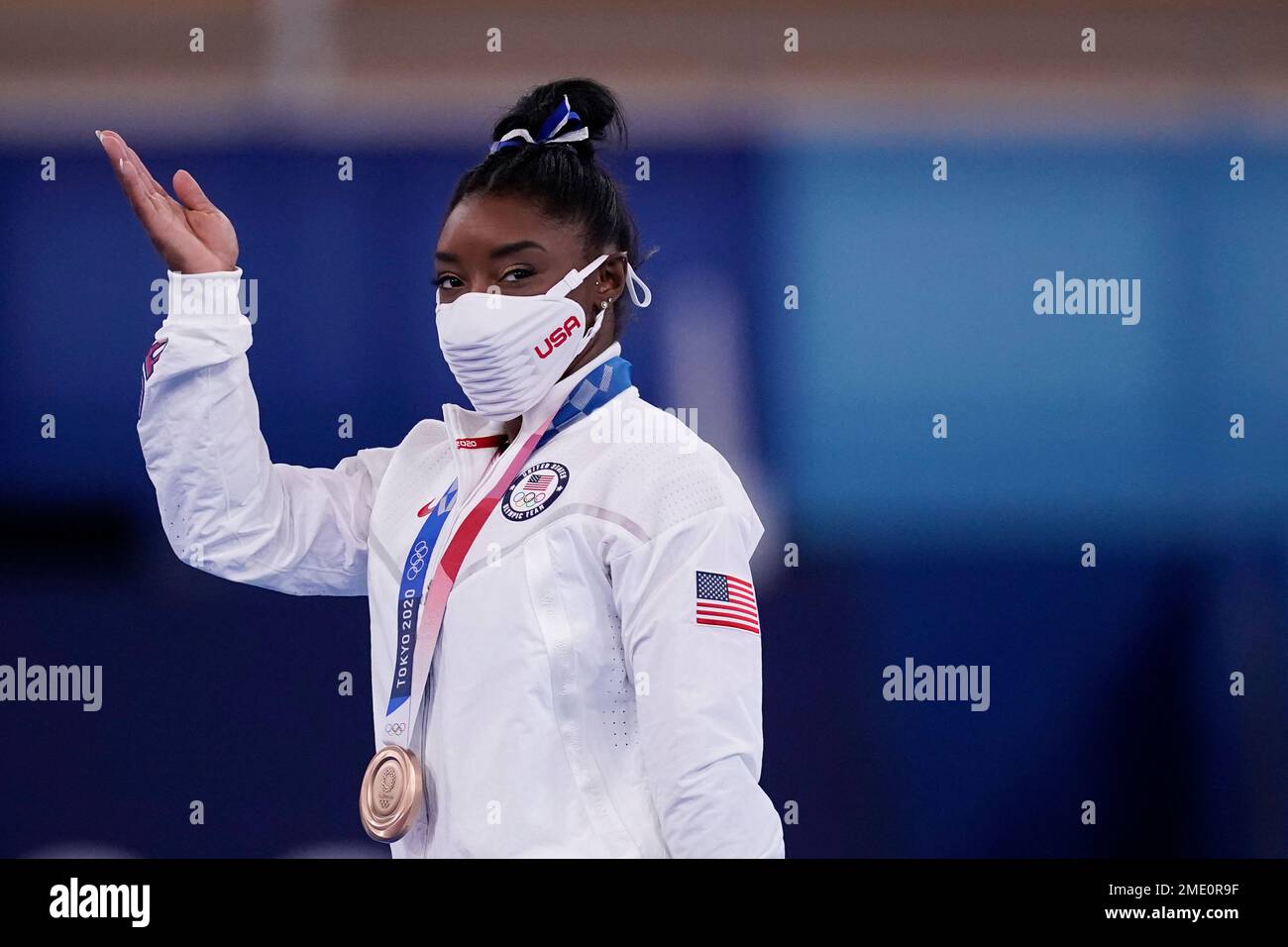 Simone Biles, of the United States, reacts after winning the bronze ...