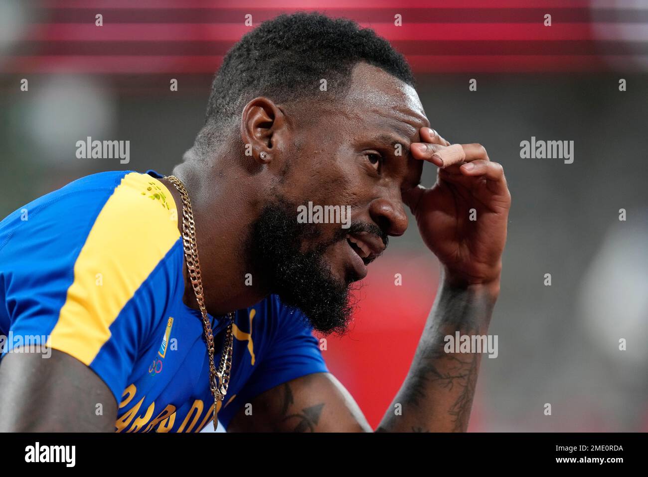 Shane Brathwaite, of Barbados, reacts after his heat of the men's 110 ...