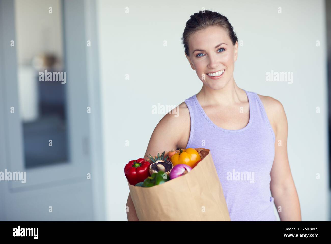 The perfect diet consists of healthy fresh foods. Portrait of a young ...