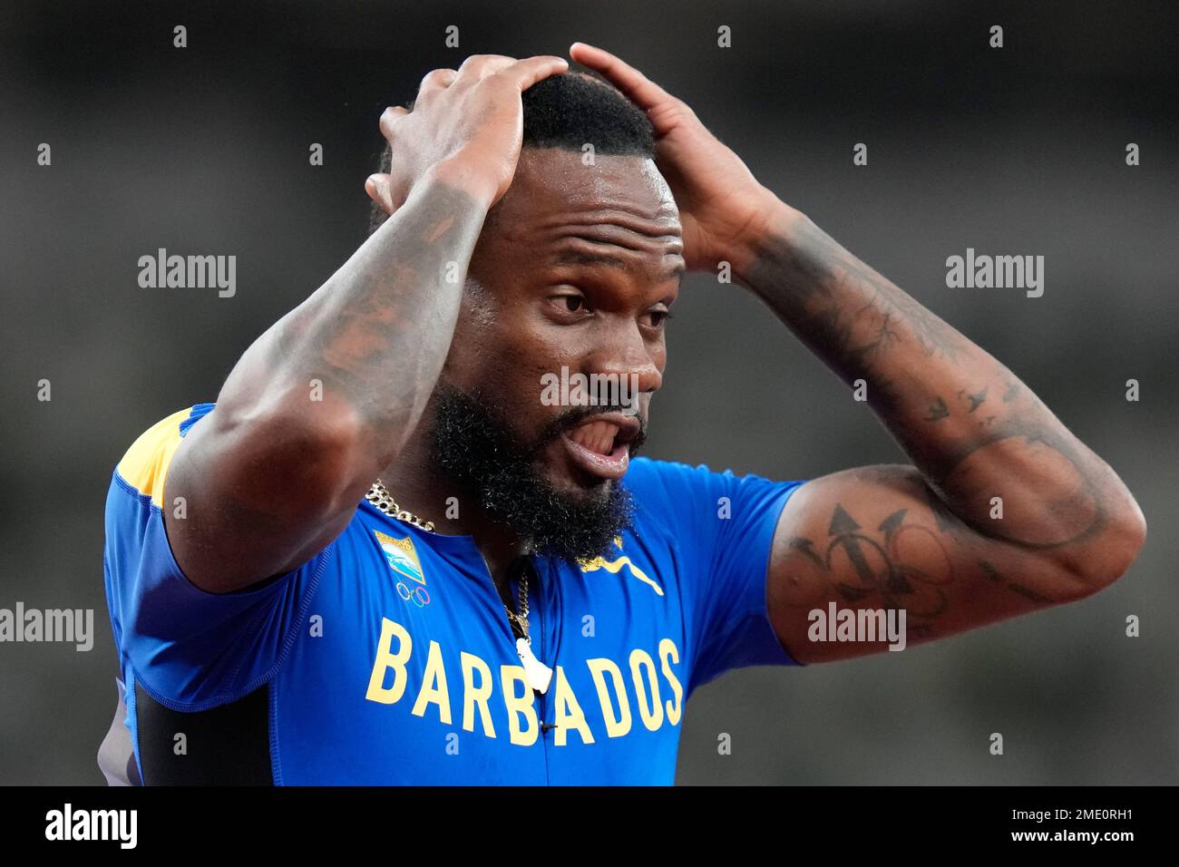 Shane Brathwaite, of Barbados, reacts after his heat of the men's 110 ...
