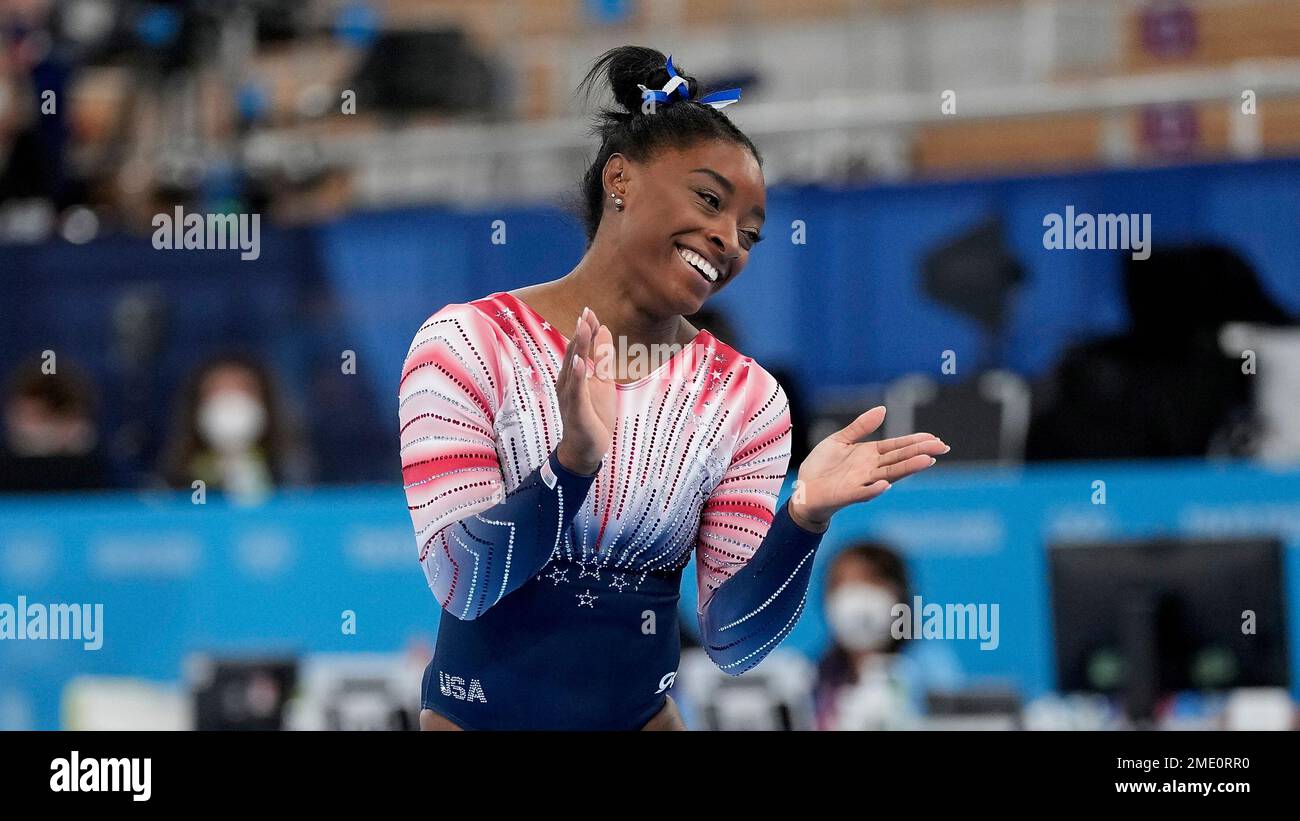 Simone Biles, of the United States, finishes on the balance beam during ...