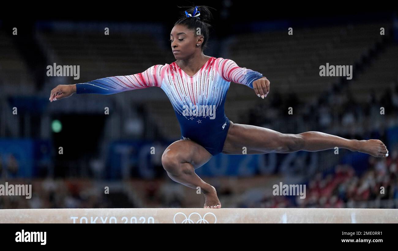 Simone Biles, of the United States, performs on the balance beam during ...