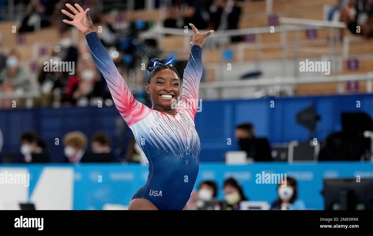 Simone Biles, of the United States, finishes on the balance beam during ...