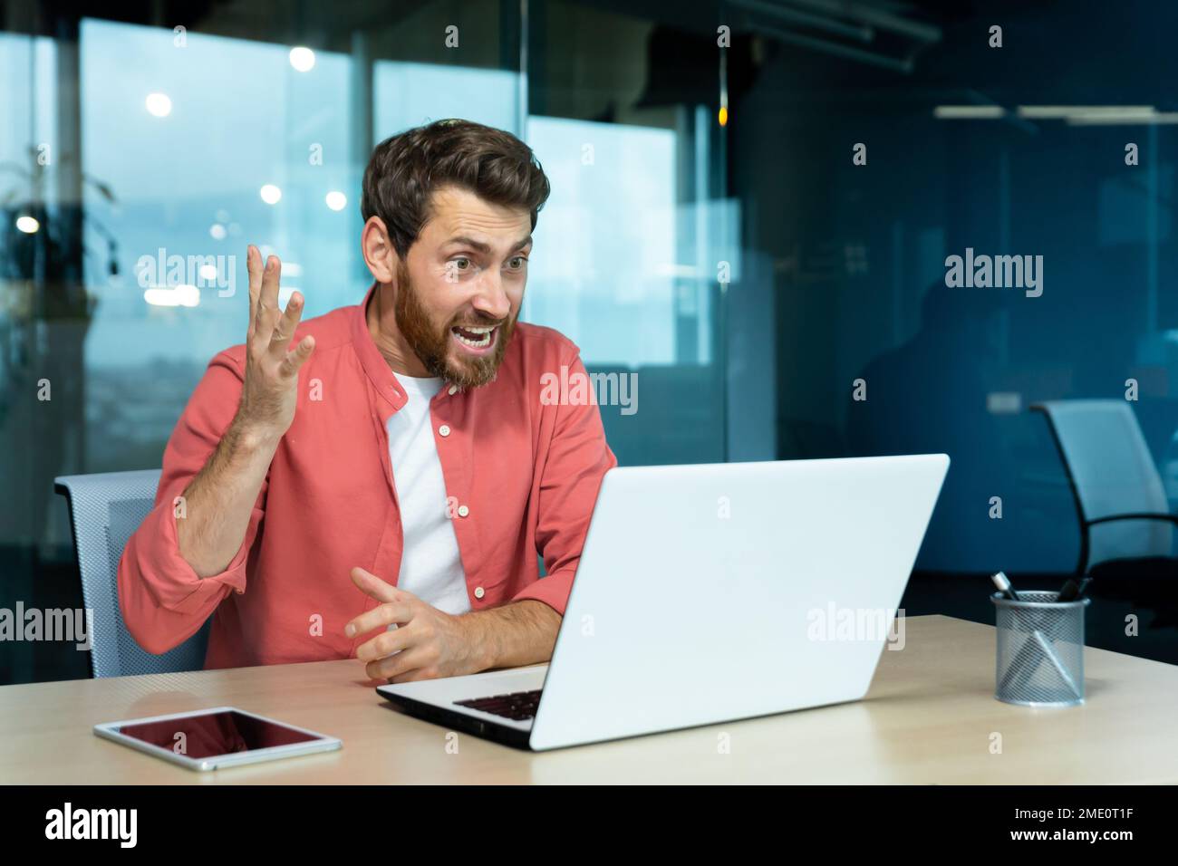 Angry and nervous businessman talking on video call remotely, man ...