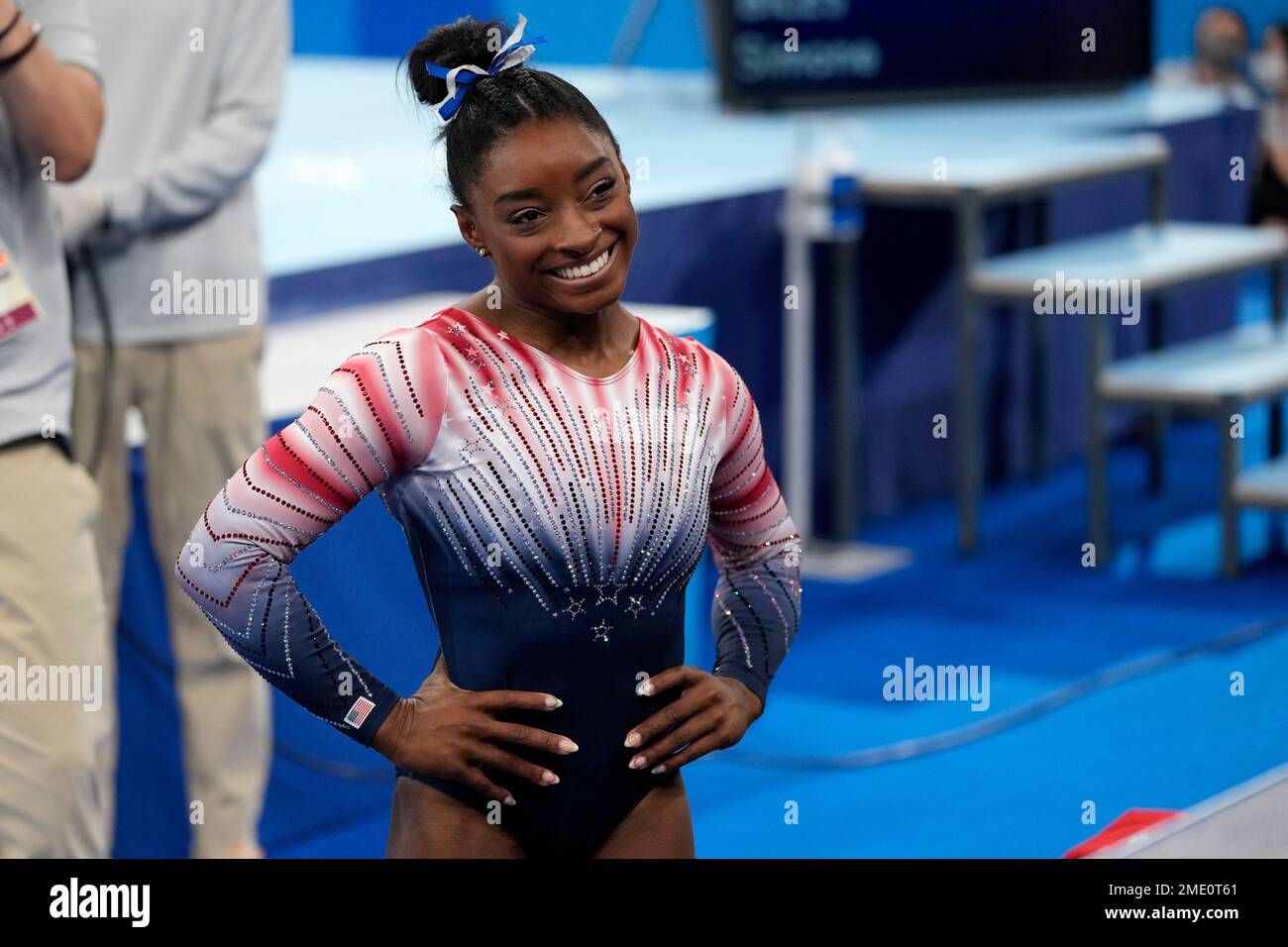 Simone Biles, of the United States, smiles after performing on the ...
