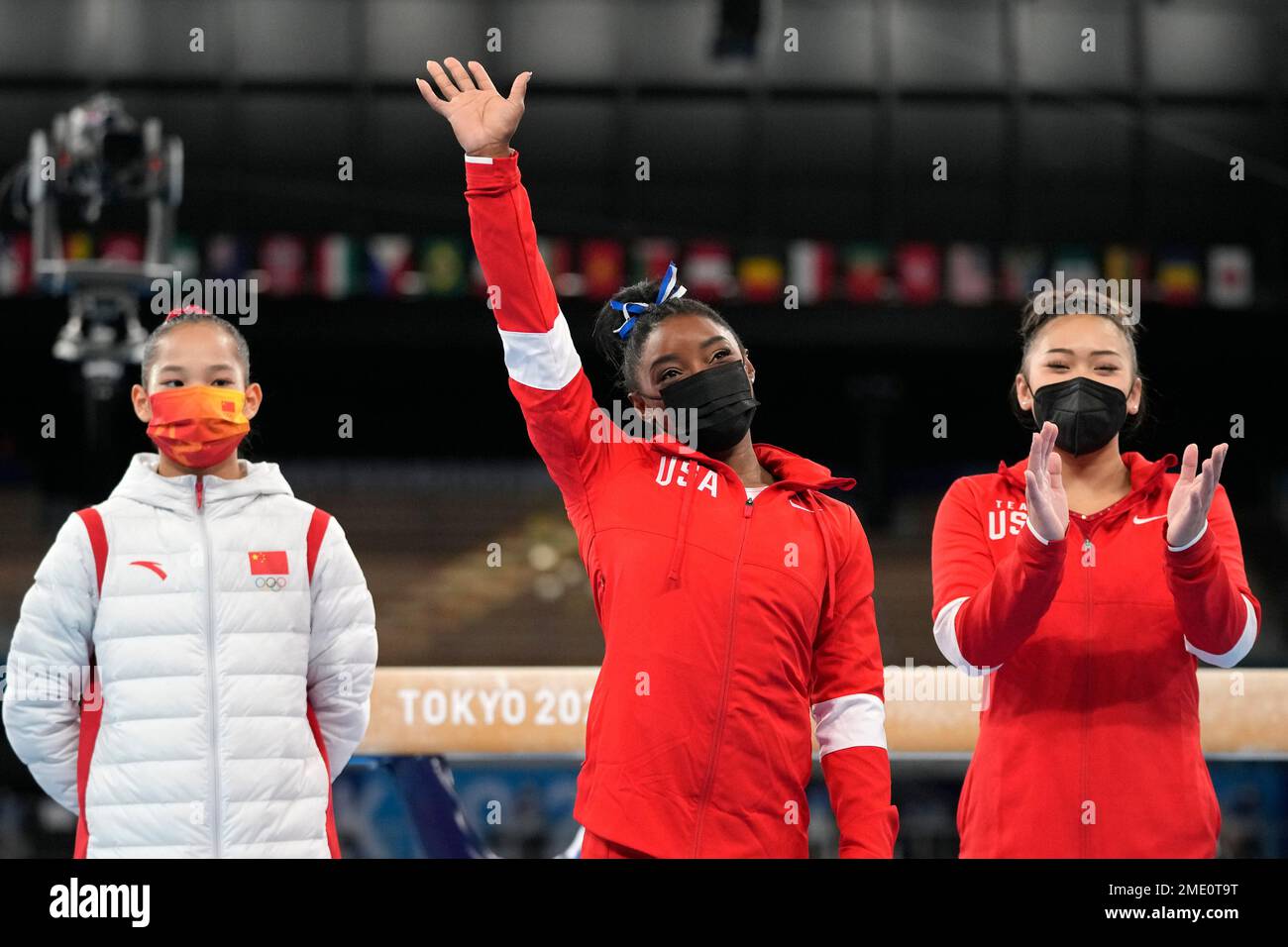 Simone Biles, of the United States, waves prior to participating in the ...