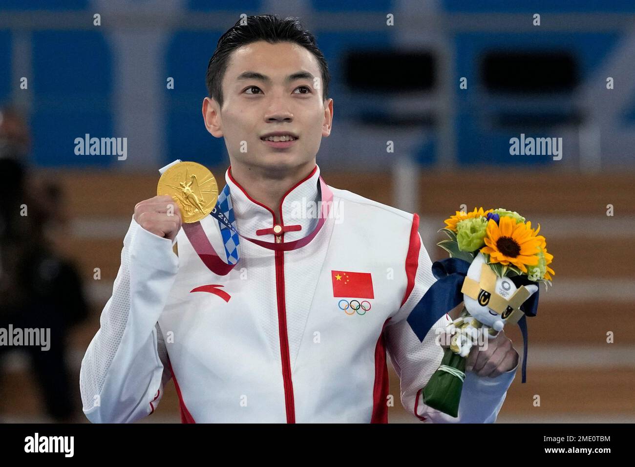 China's Zou Jingyuan celebrates after winning the gold medal for the ...