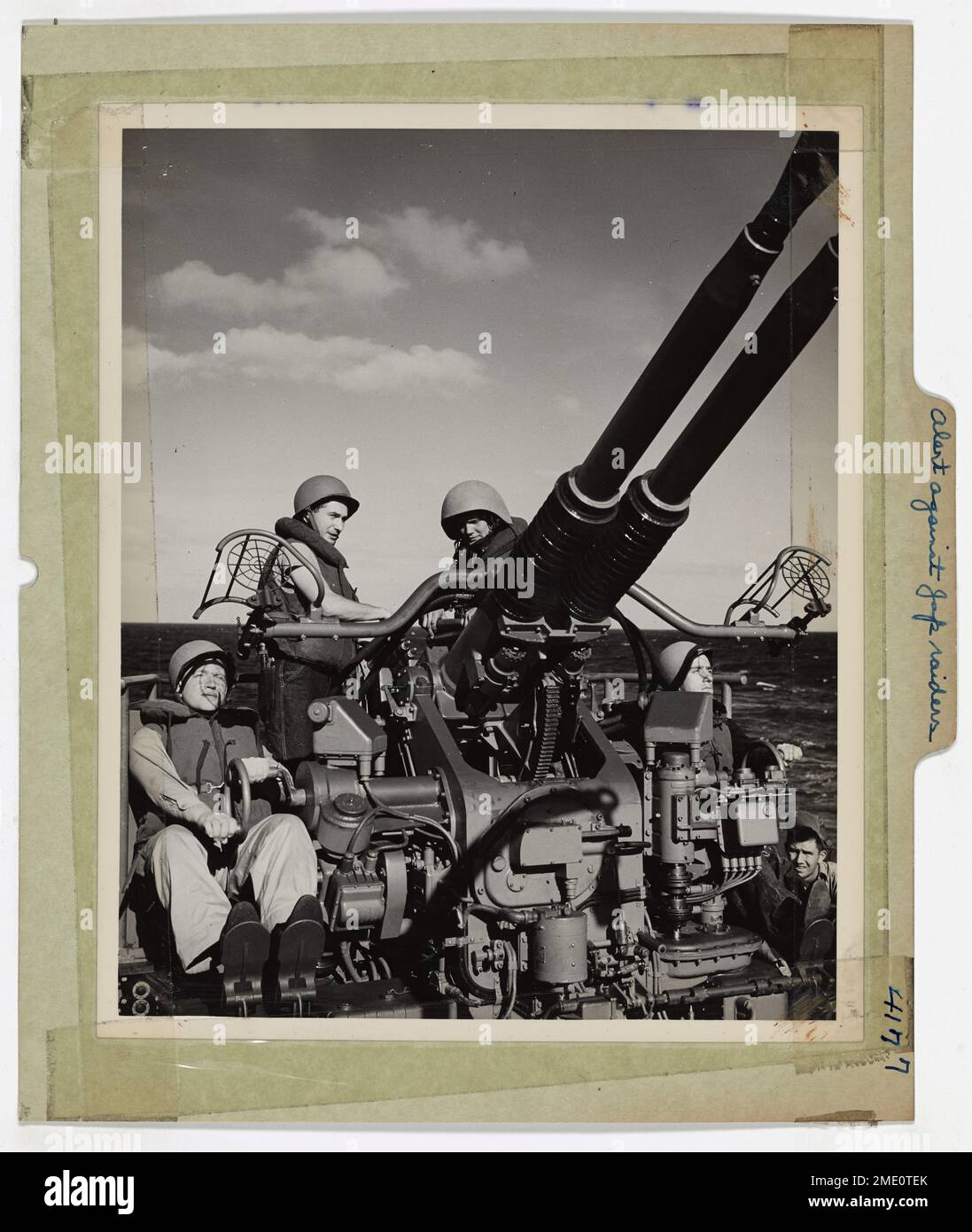 A Coast Guard gun crew manning an anti-aircraft battery aboard a Coast ...