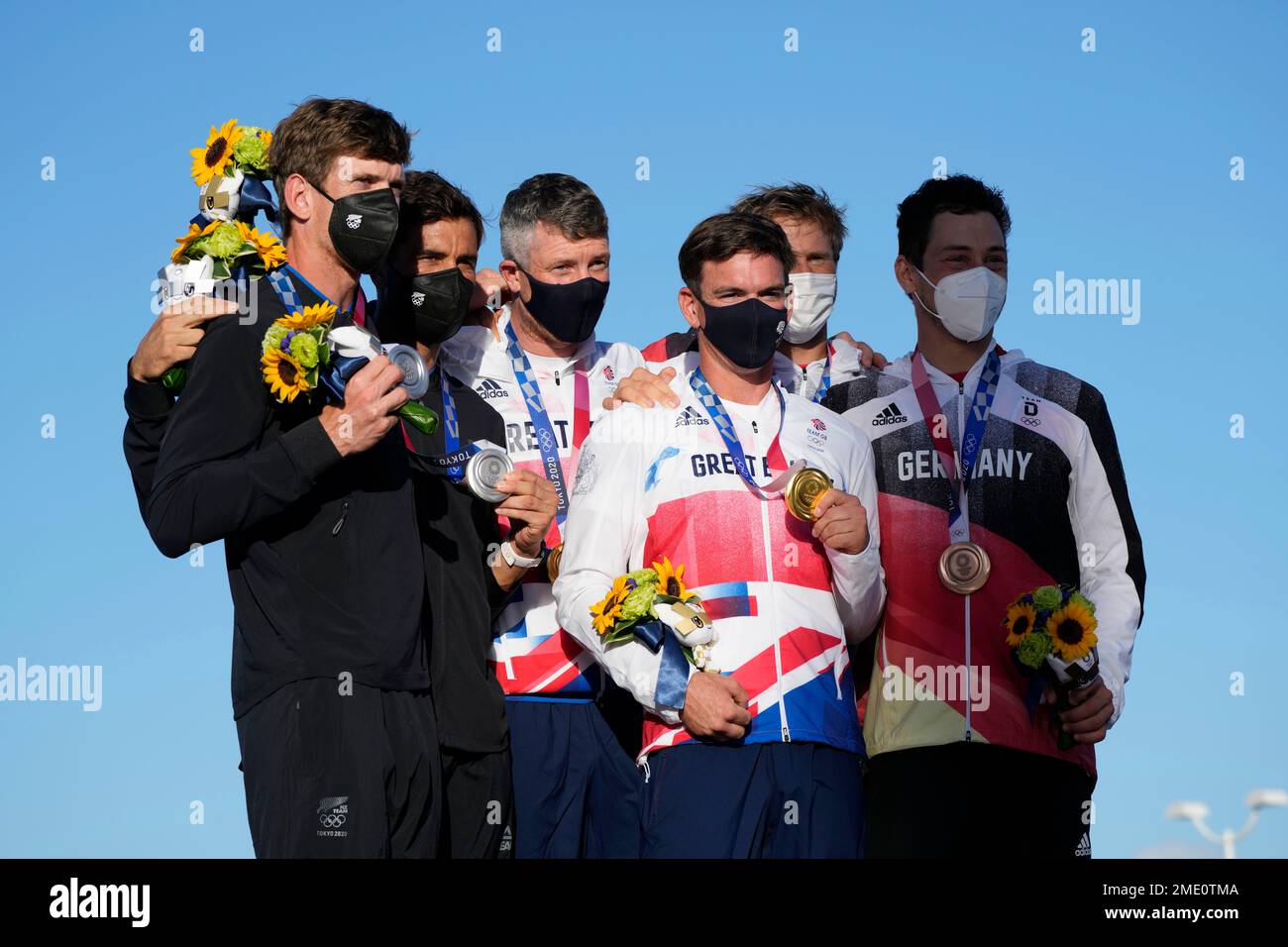 From left, second placed New Zealand's Peter Burling, Blair Tuke, first ...