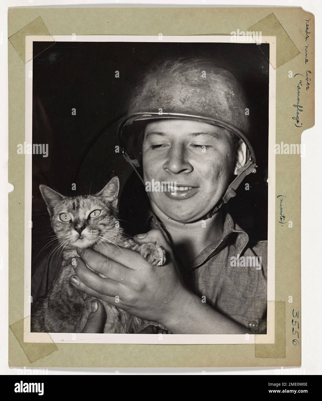 Photograph of Coast Guardsman Henry Richmond, Jr. Holding "Camouflage ...