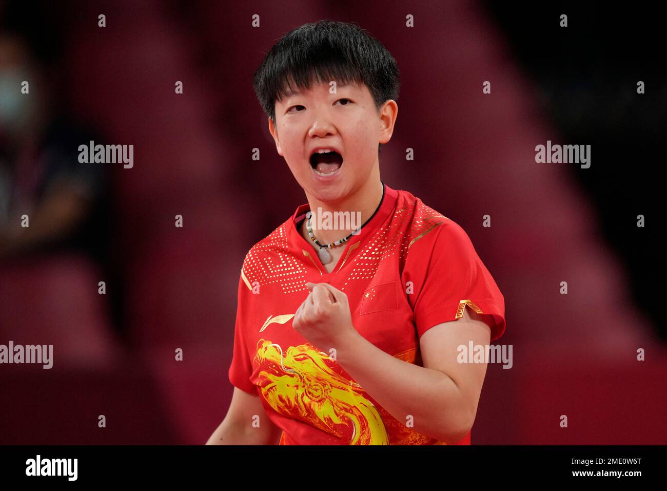 China's Sun Yingsha reacts during the table tennis quarterfinal women's ...