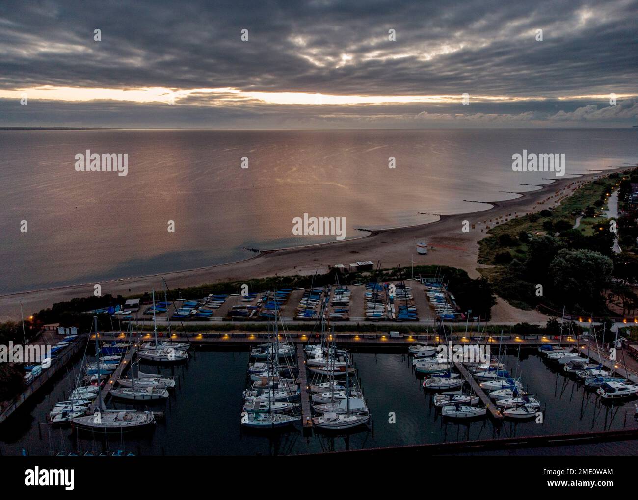 Sailboats lie in the small harbor of Niendorf at the Baltic Sea ...