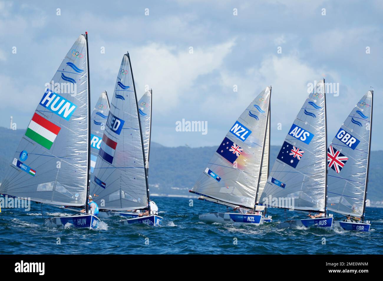 Boats compete for position in the men's Finn medal race at the 2020 ...
